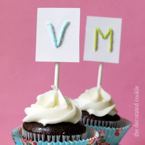 yarn stitched MONOGRAMMED CUPCAKE TOPPERS for a fun idea