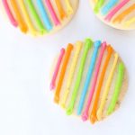 RAINBOW COOKIES piped with frosting and decorating tips for Pride.