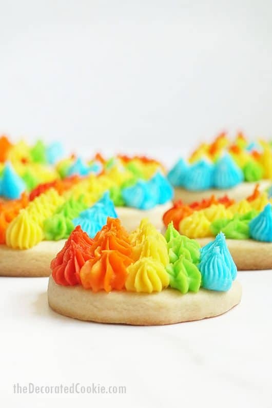 RAINBOW COOKIES piped with frosting and decorating tips for Pride.