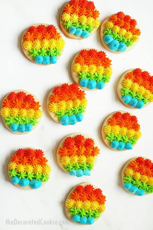 RAINBOW COOKIES piped with frosting and decorating tips for Pride.