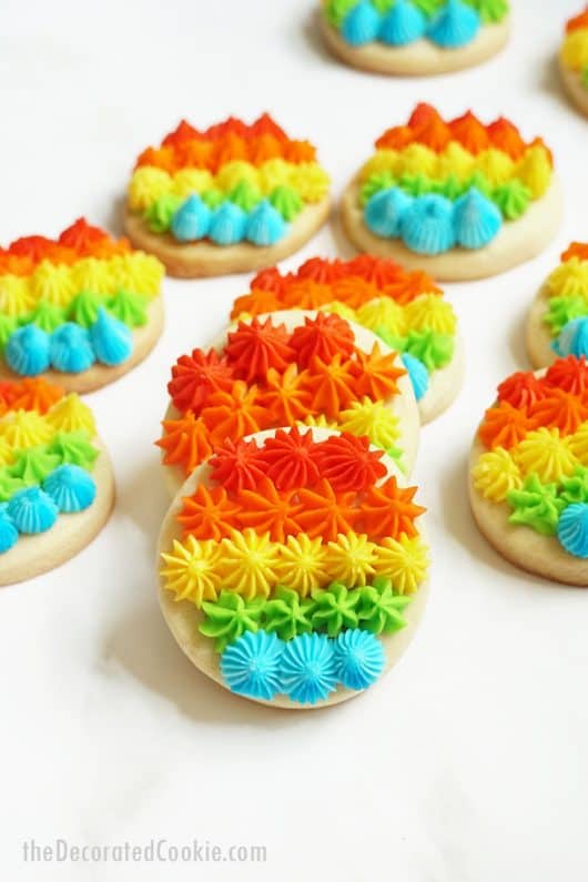 RAINBOW COOKIES piped with frosting and decorating tips for Pride.